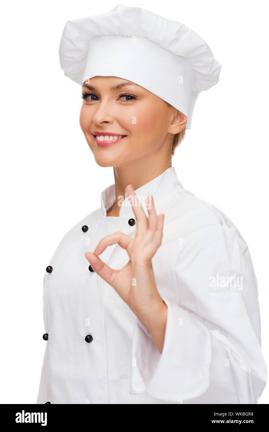 cooking, gesture and food concept - smiling female chef showing ok hand ...