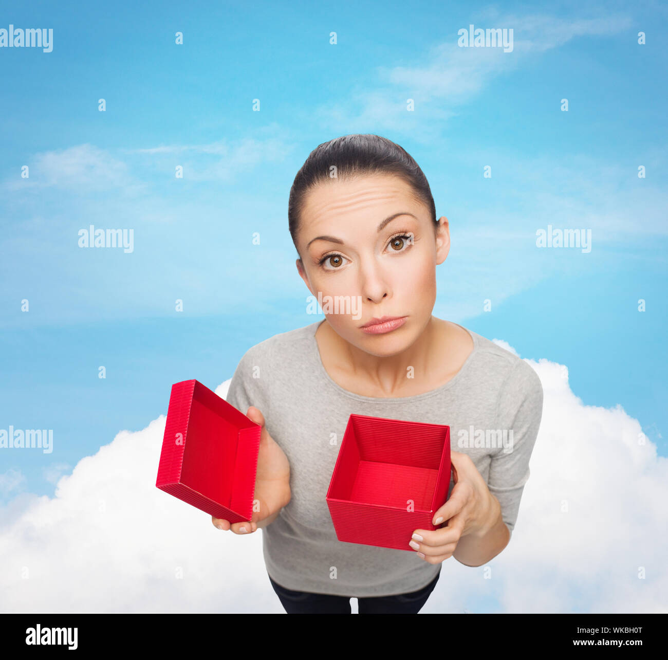 disappointed asian woman with empty red gift box Stock Photo - Alamy