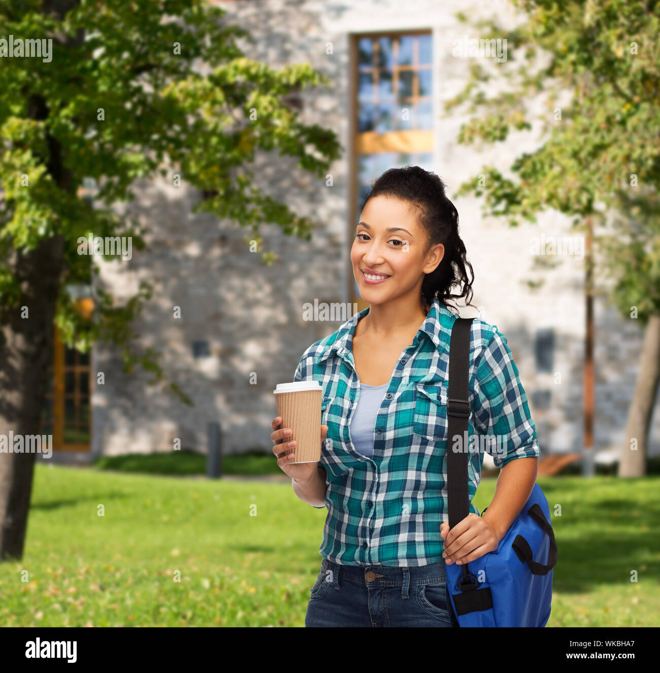 smiling student with bag and take away coffee cup Stock Photo - Alamy