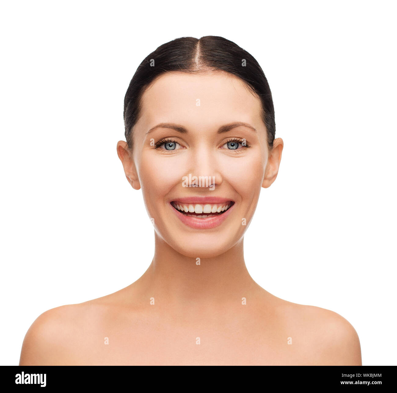 health, spa and beauty concept - clean face of beautiful young laughing ...