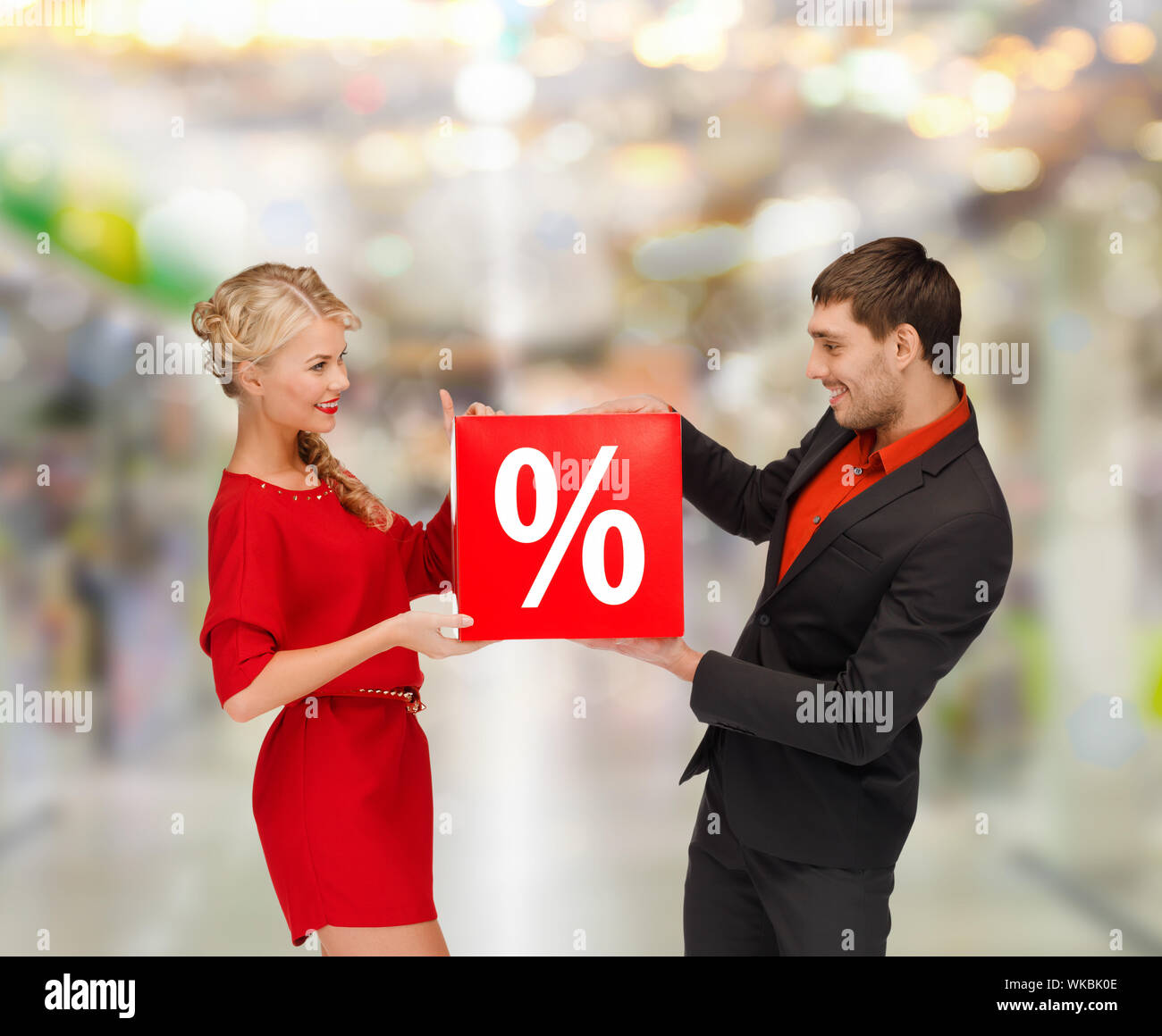 shopping, sale, christmas, couple and mall concept - smiling woman and ...