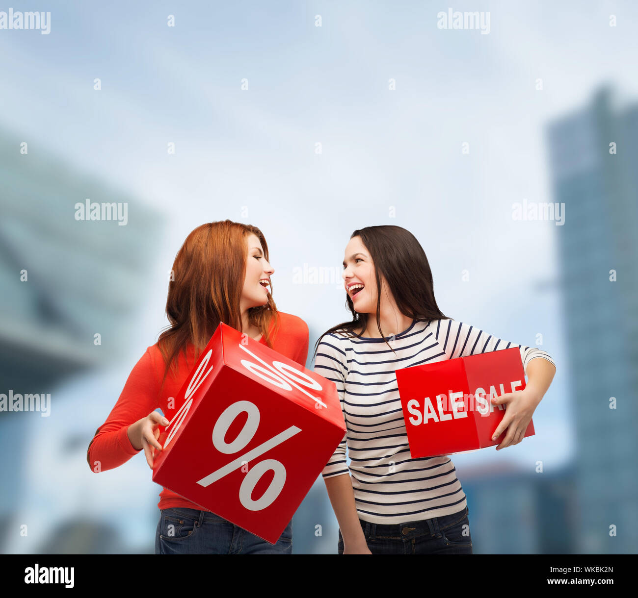 smiling teenage girl with percent and sale sign Stock Photo - Alamy