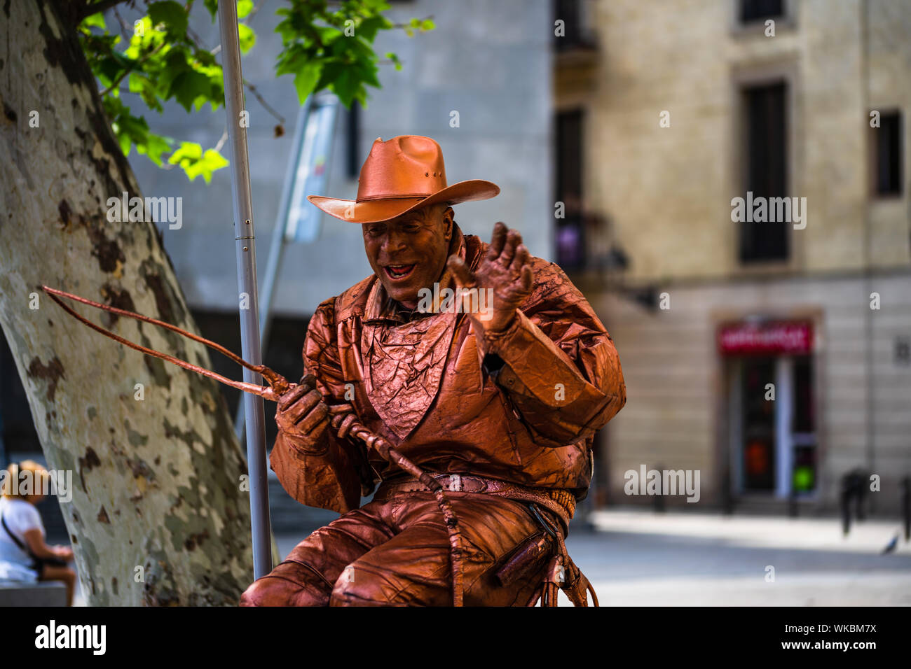 Barcelona, Spain – 2019. Man dressed as cowboy gives live statue ...