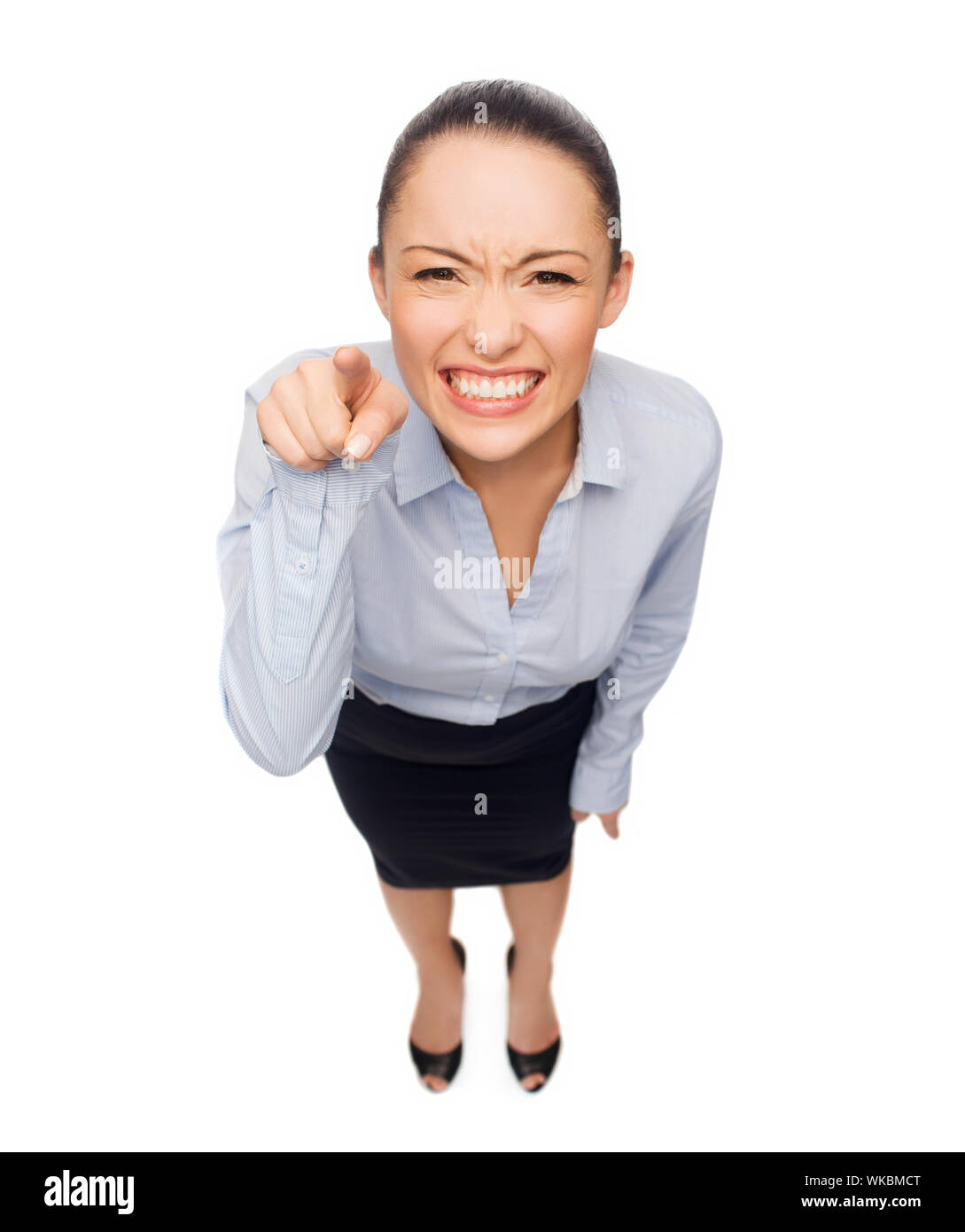 business and emotion concept - angry businesswoman pointing finger at ...