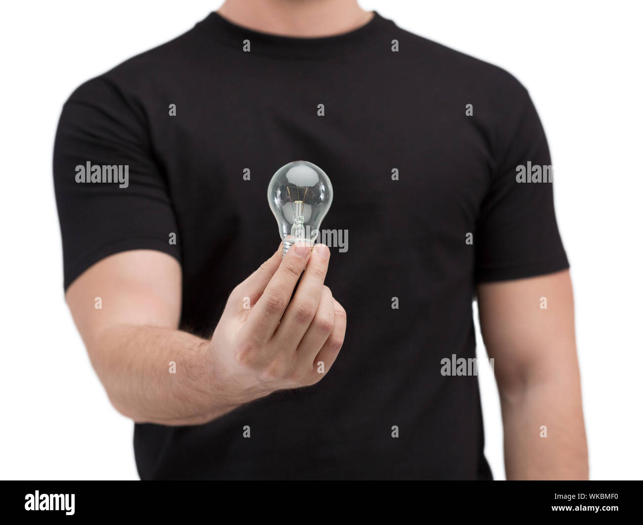 electricity and energy concept - close up of man holding light bulb ...