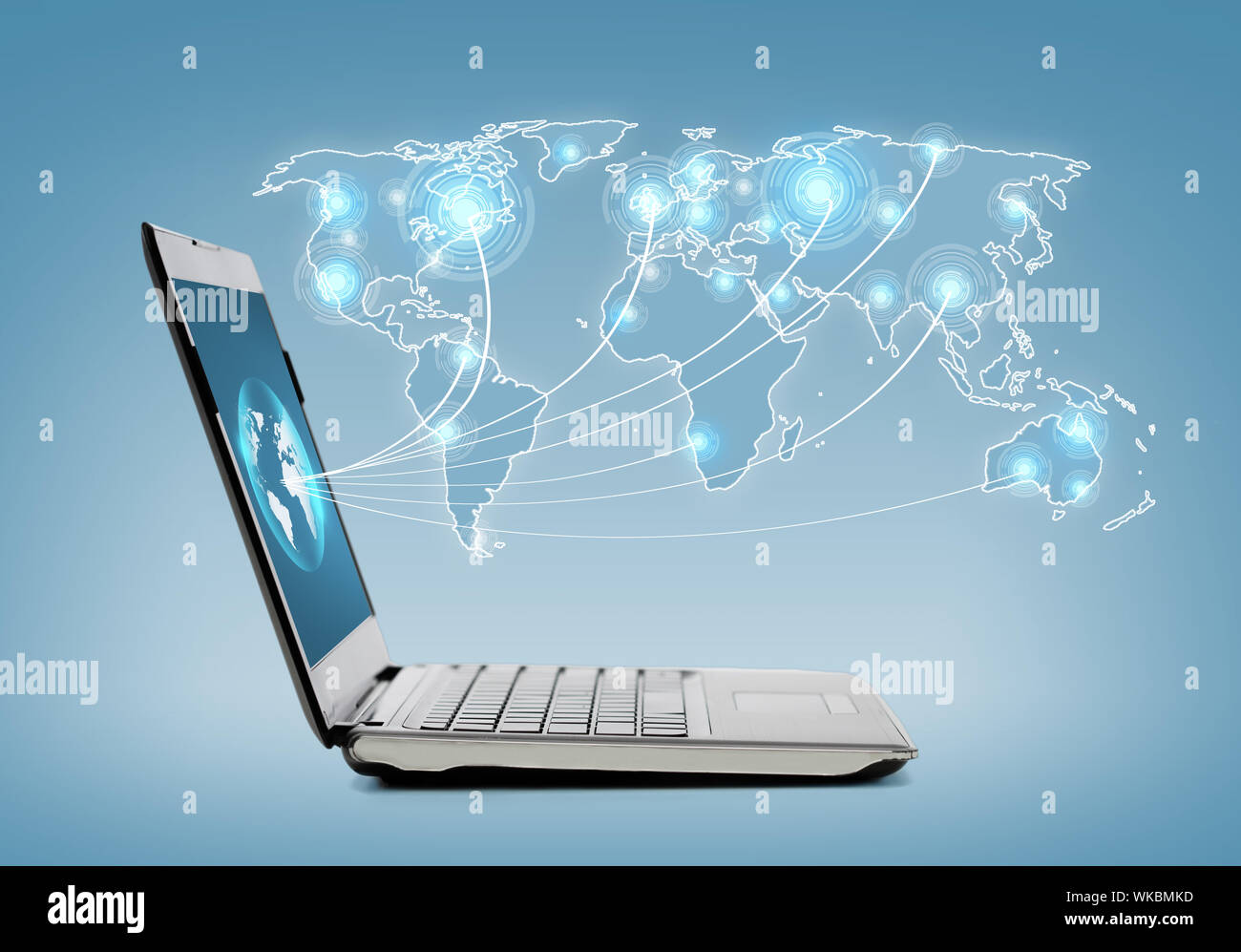technology and networking concept - laptop computer with map hologramm ...