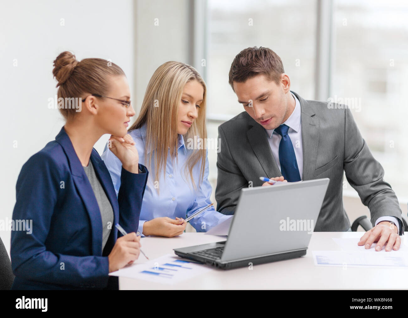 business, technology and office concept - concentrated business team ...