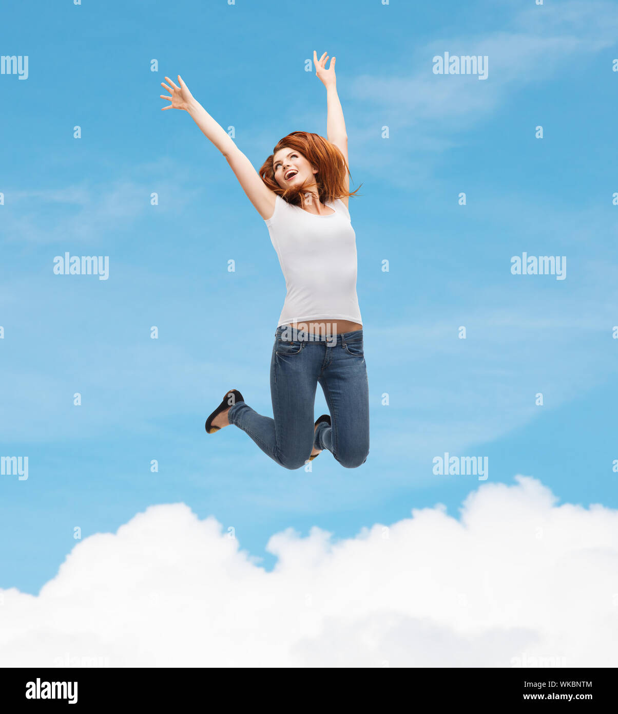 teenage girl in white blank t-shirt jumping Stock Photo - Alamy