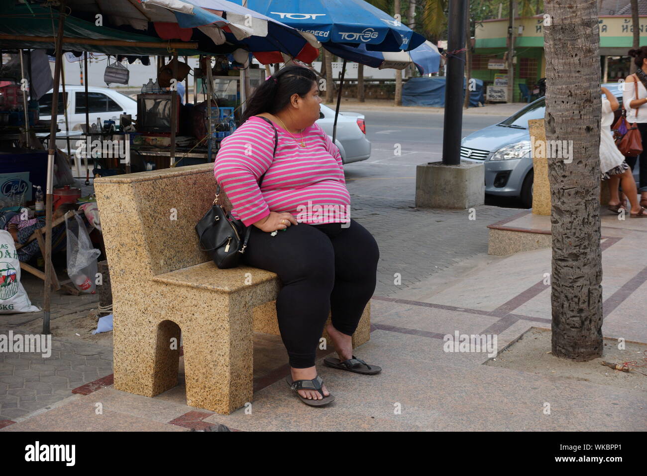 Overweight woman sitting on bench High Resolution Stock Photography and ...