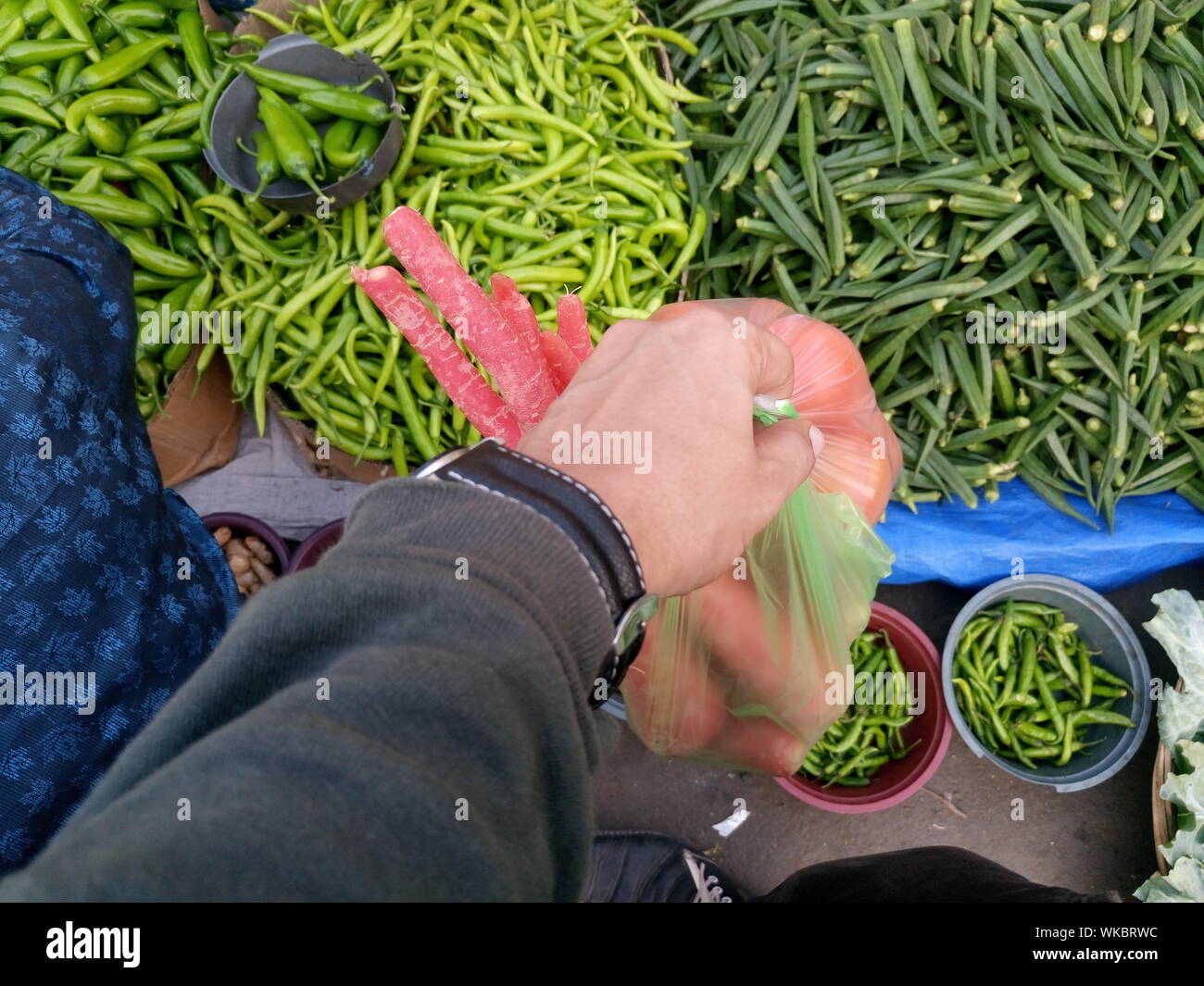 Man carrying plastic bag hi-res stock photography and images - Alamy