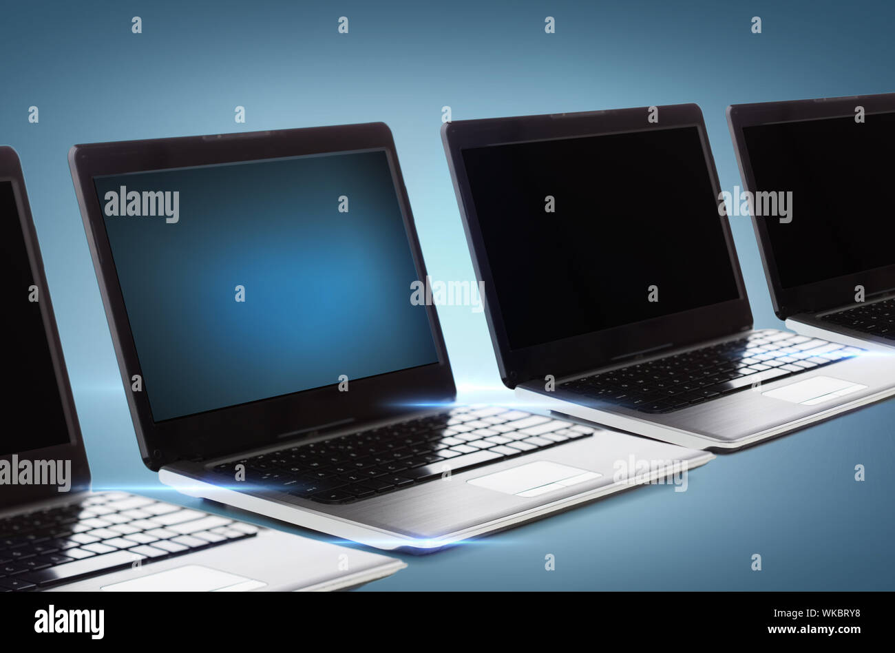 many laptop computers with blank black screens Stock Photo - Alamy
