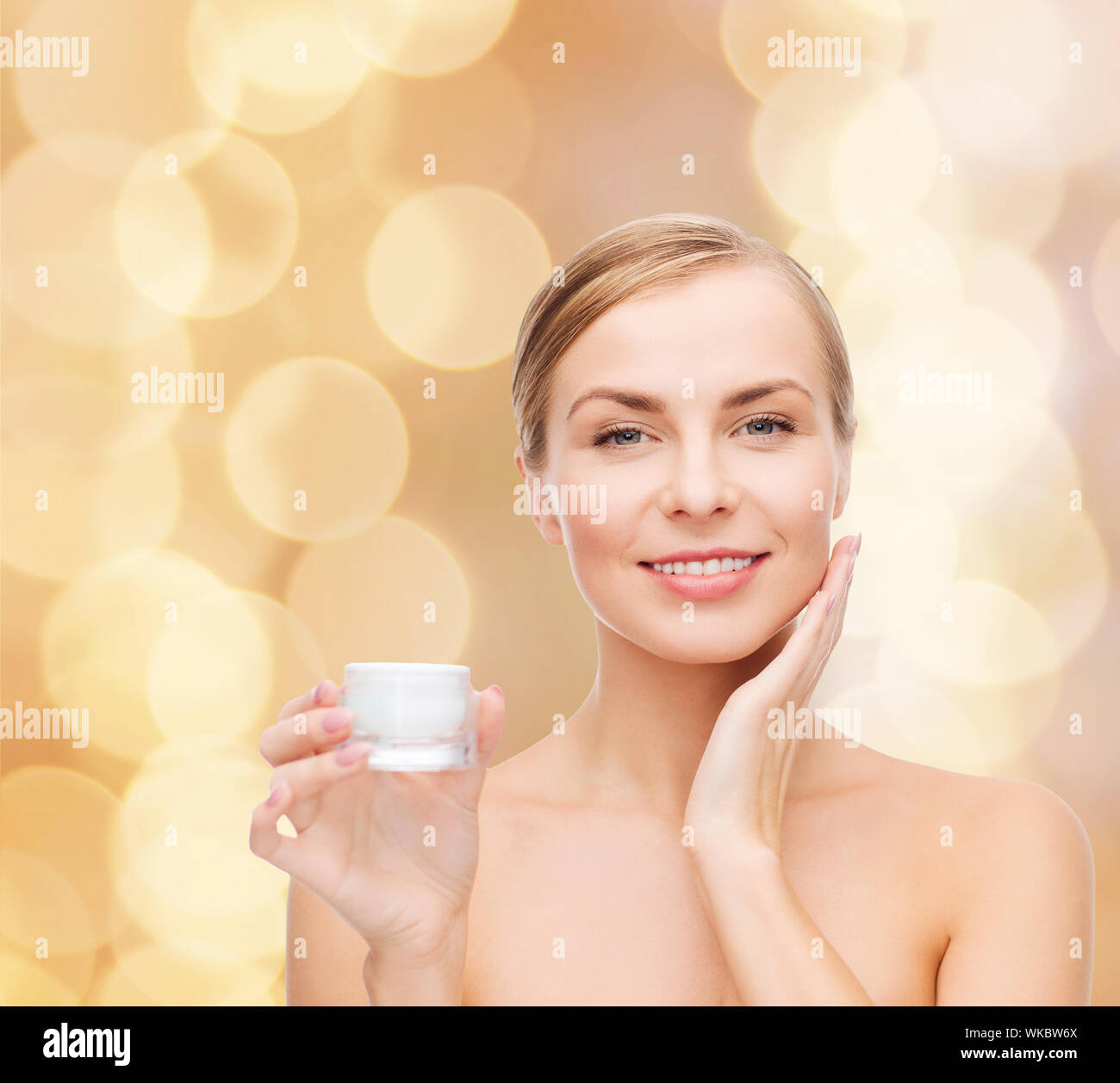 woman applying cream on her skin Stock Photo - Alamy