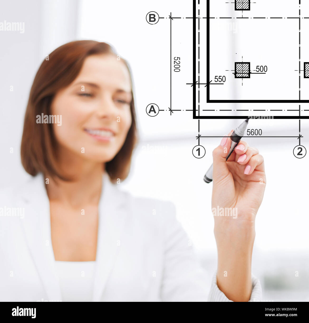 female architect drawing blueprint Stock Photo - Alamy