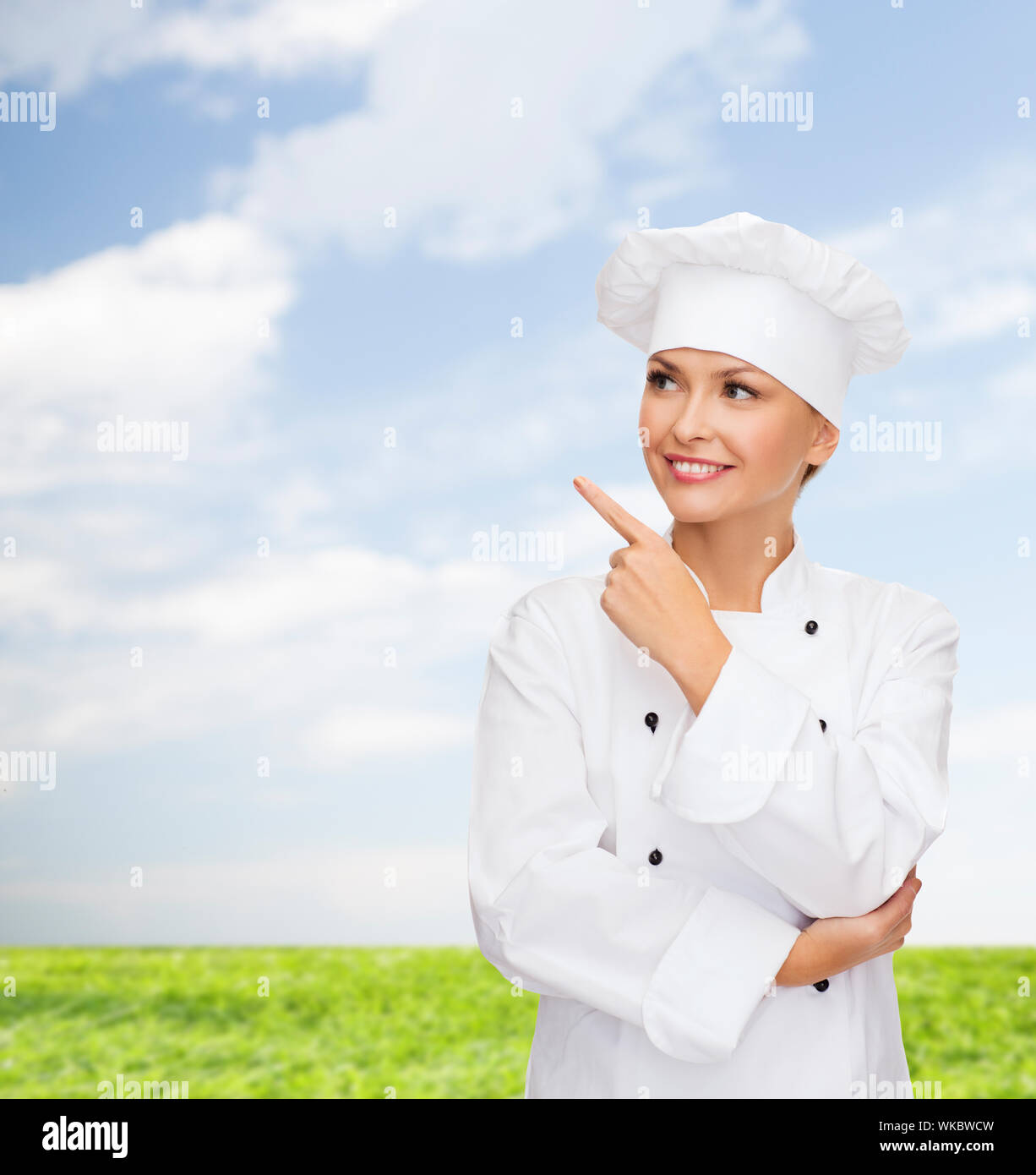 cooking, advertisement and food concept - smiling female chef, cook or ...