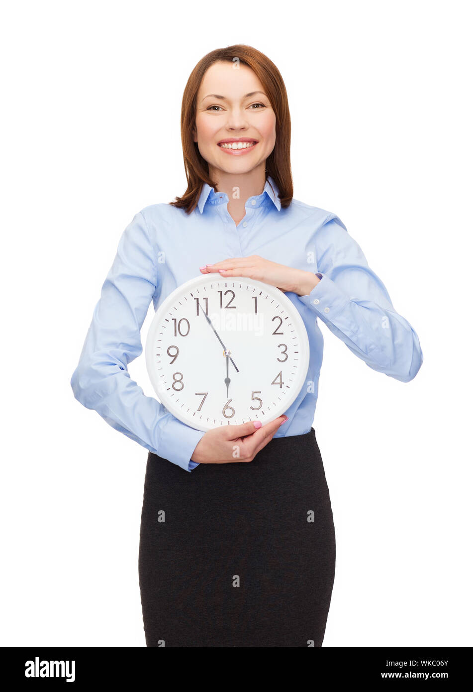 business and time concept - attractive businesswoman with wall clock ...