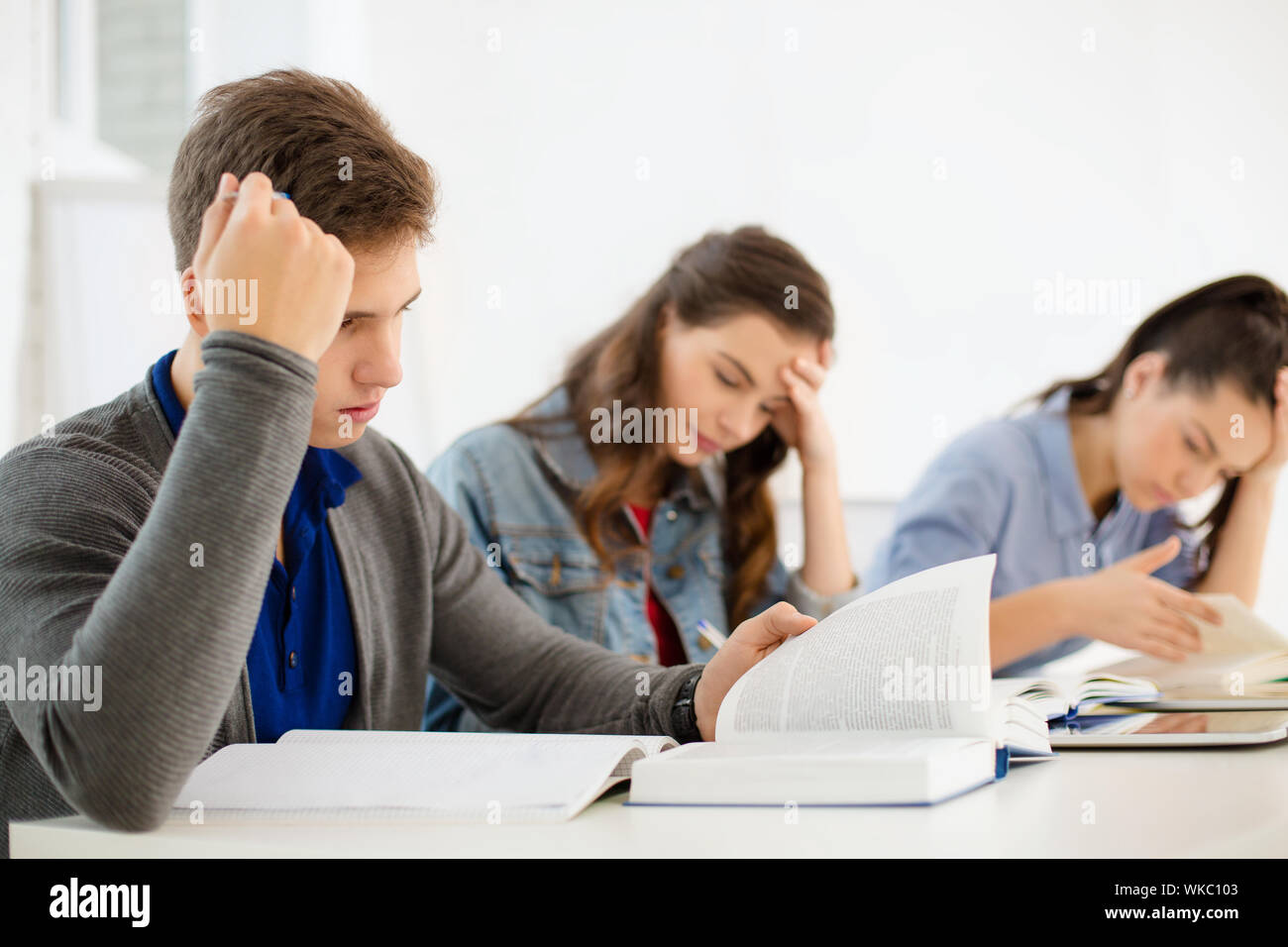 students with notebooks and tablet pc at school Stock Photo - Alamy