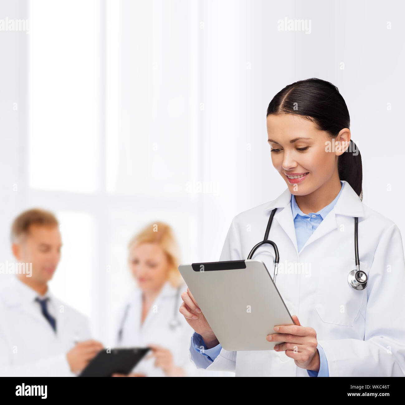 healthcare, technology and medicine concept - smiling female doctor ...