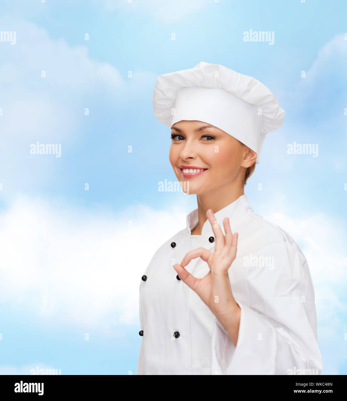cooking, gesture and food concept - smiling female chef showing ok hand ...