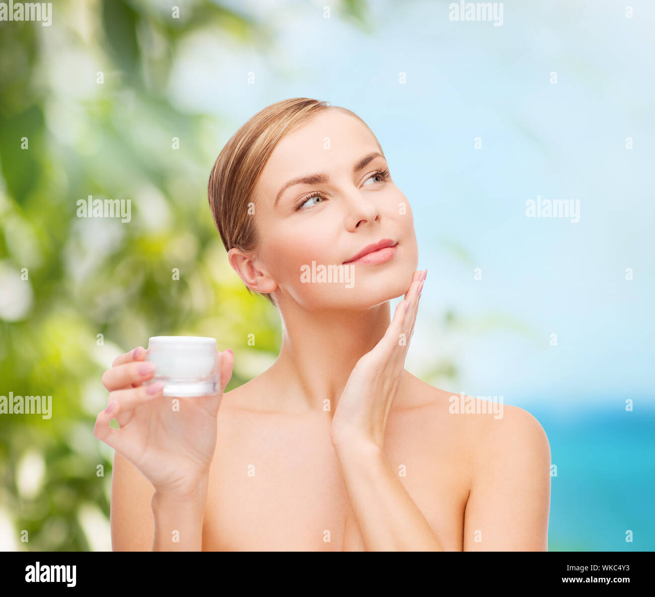 Cosmetics Health And Beauty Concept Beautiful Woman Applying Cream
