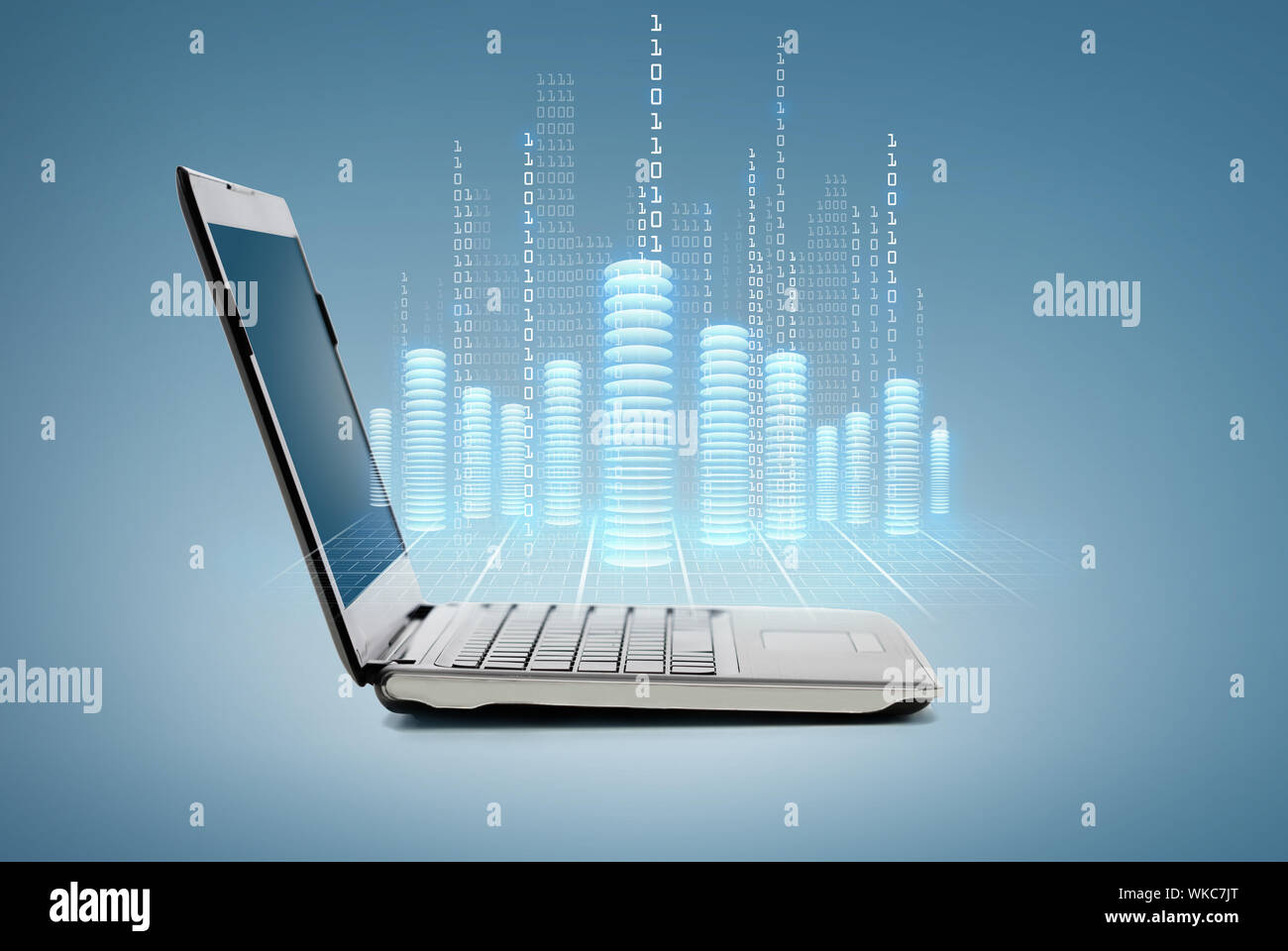 laptop computer with digital coins and data Stock Photo - Alamy