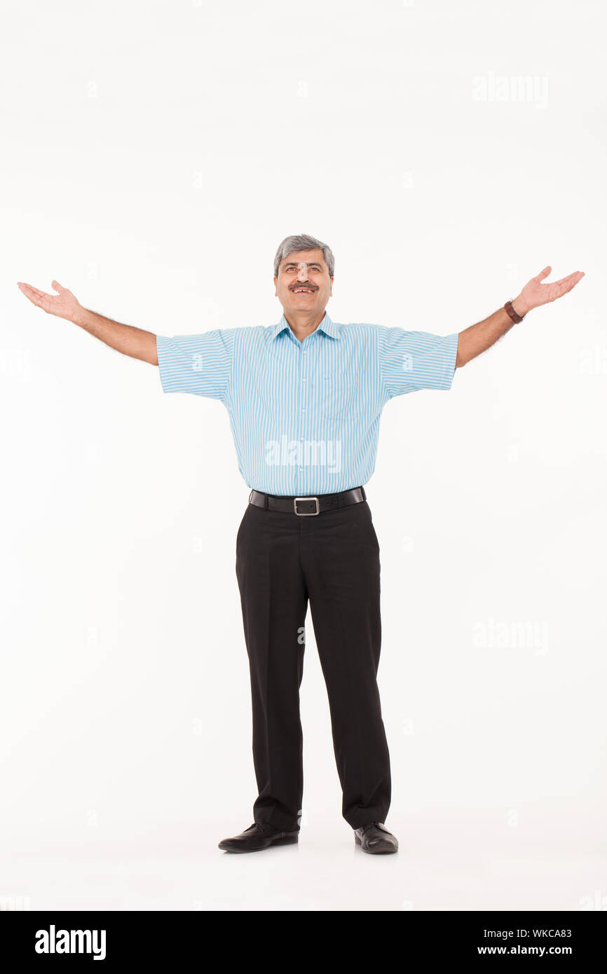Businessman standing with his arm outstretched Stock Photo - Alamy