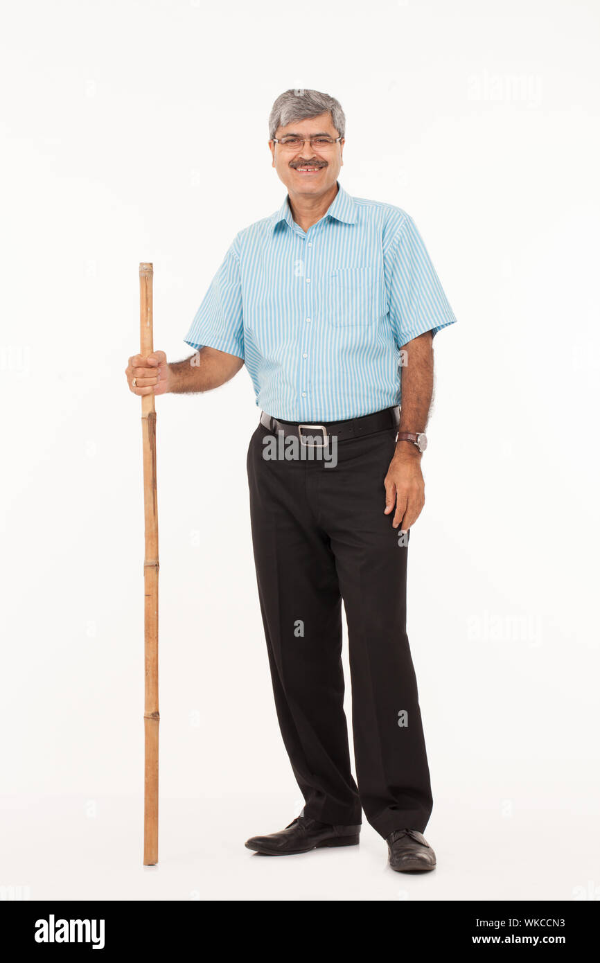 Man with lathi hi-res stock photography and images - Alamy