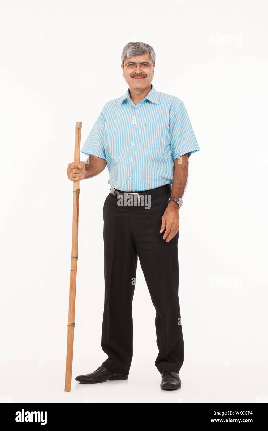 Man with lathi hi-res stock photography and images - Alamy