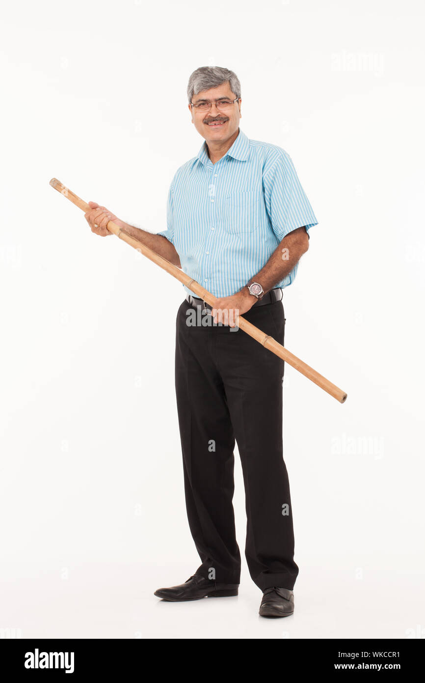 Man standing with his cane and smiling Stock Photo - Alamy