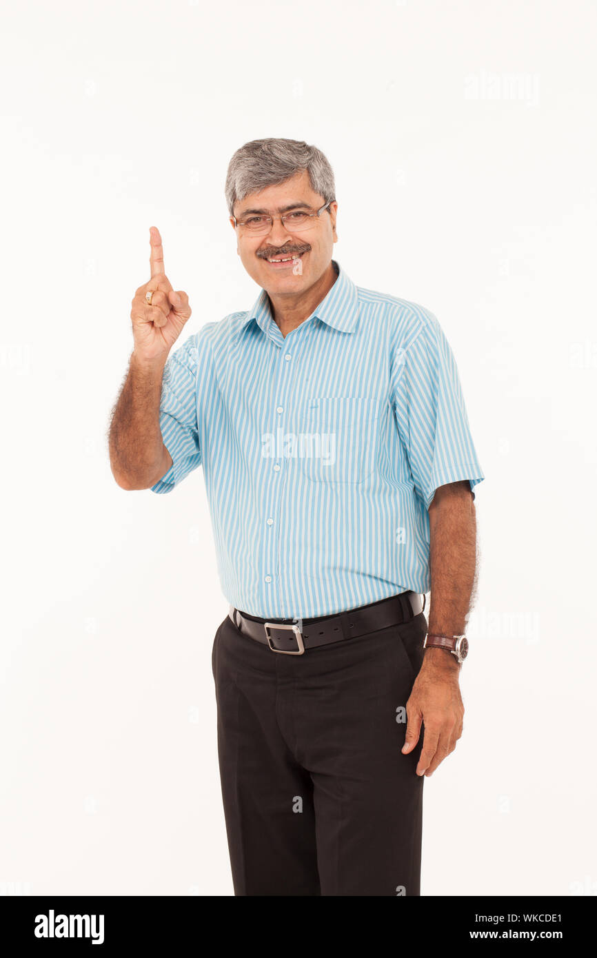 Businessman pointing upward Stock Photo - Alamy