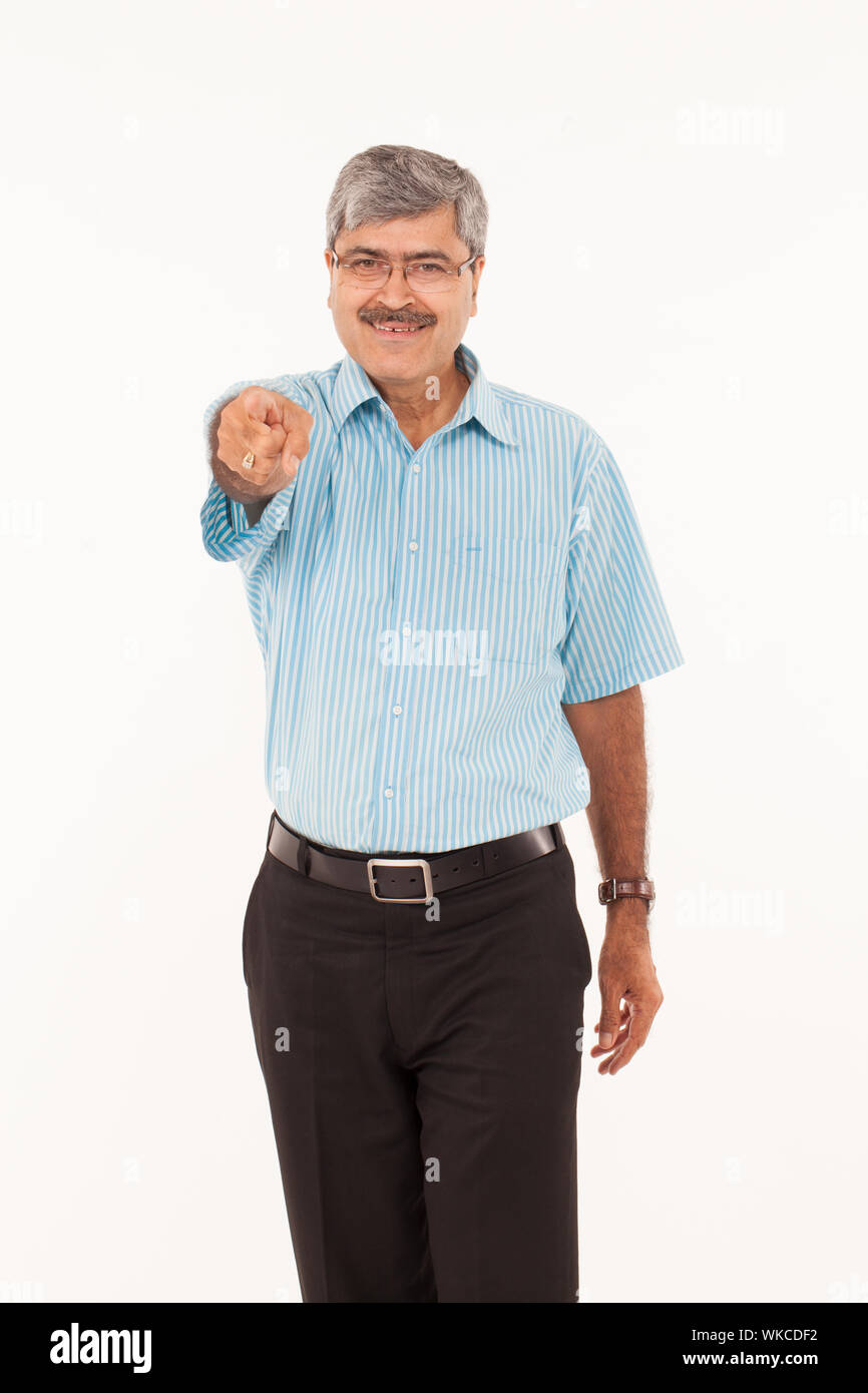 Businessman pointing toward camera Stock Photo - Alamy
