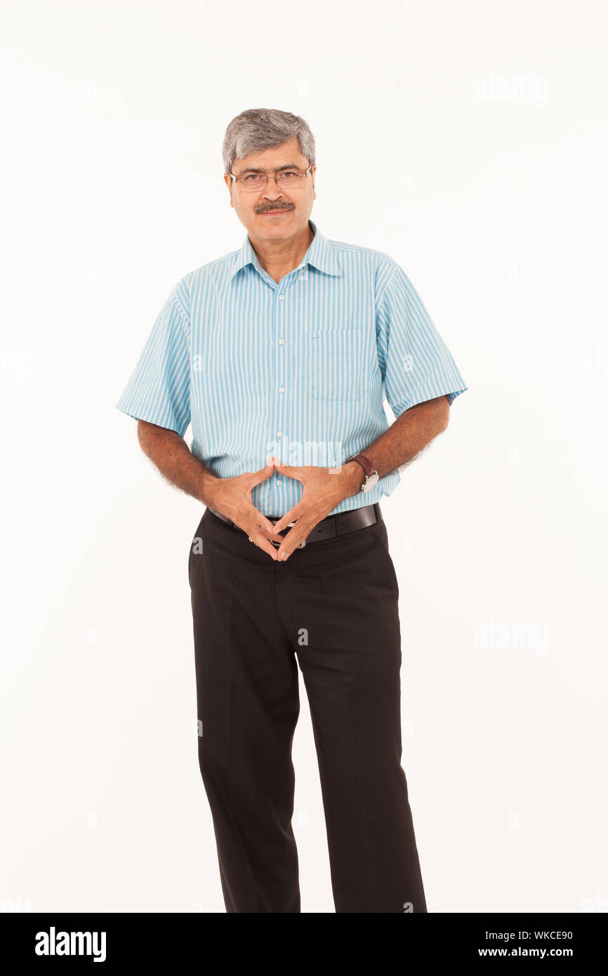 Man standing seriously Stock Photo - Alamy