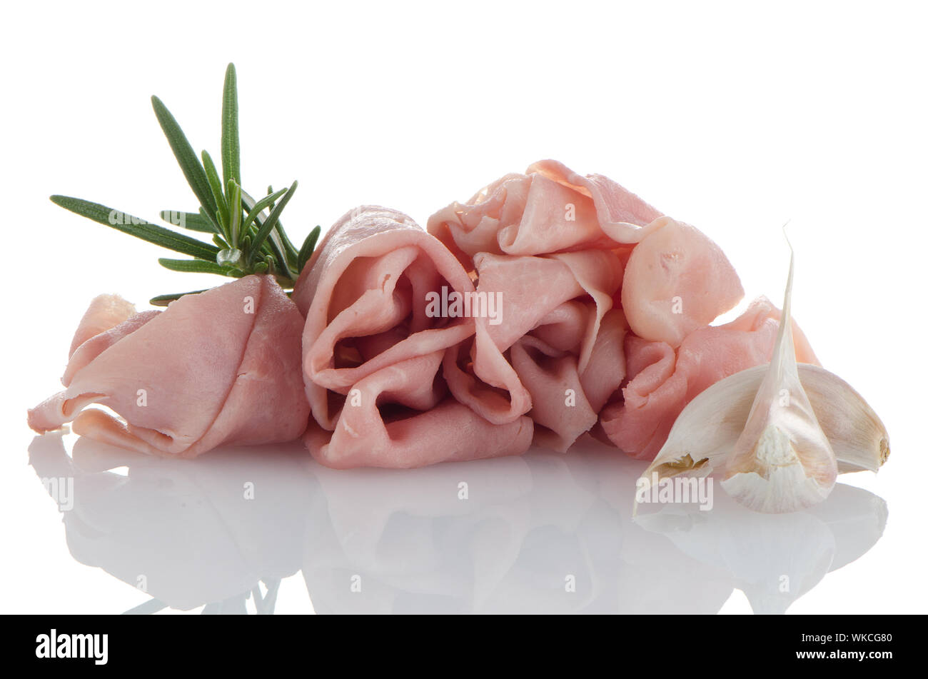 fresh shaved ham on a white background Stock Photo - Alamy