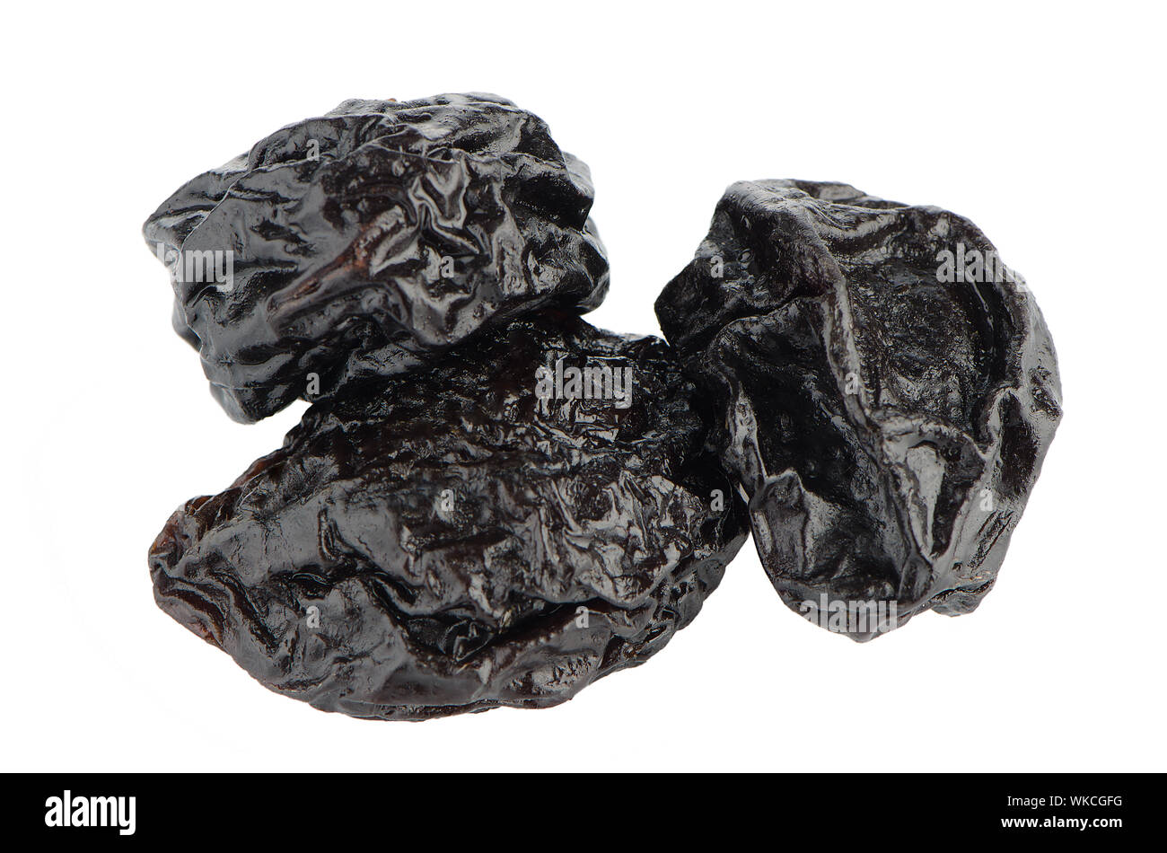 Dried plum fruits - prunes isolated on white background Stock Photo - Alamy