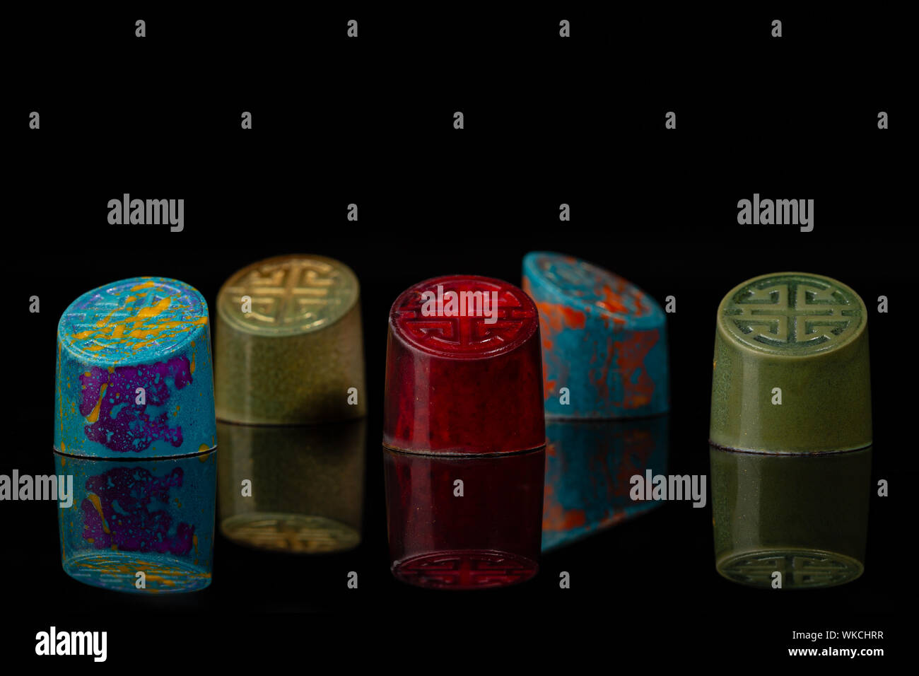 Modern chocolate candy collection on black background Stock Photo - Alamy