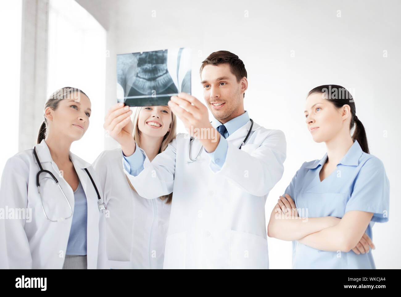 young group of doctors looking at x-ray Stock Photo - Alamy