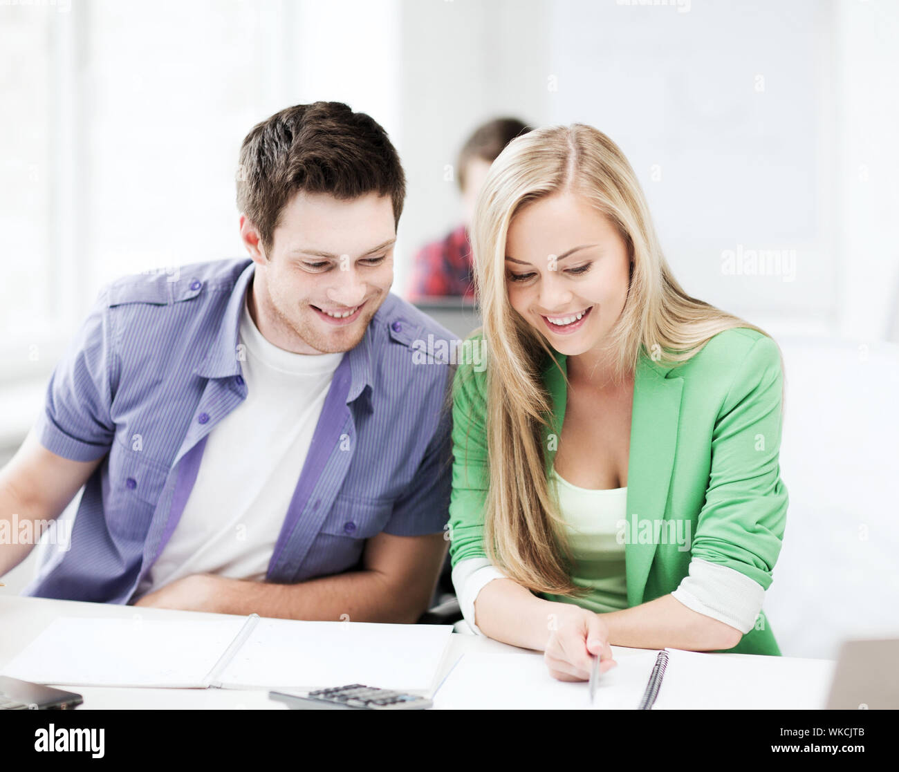 education concept - smiling students doing mathematics at school Stock ...