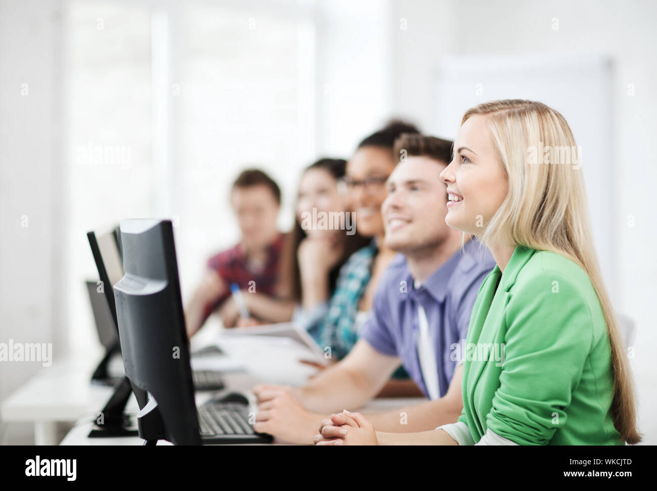education concept - students with computers studying at school Stock ...