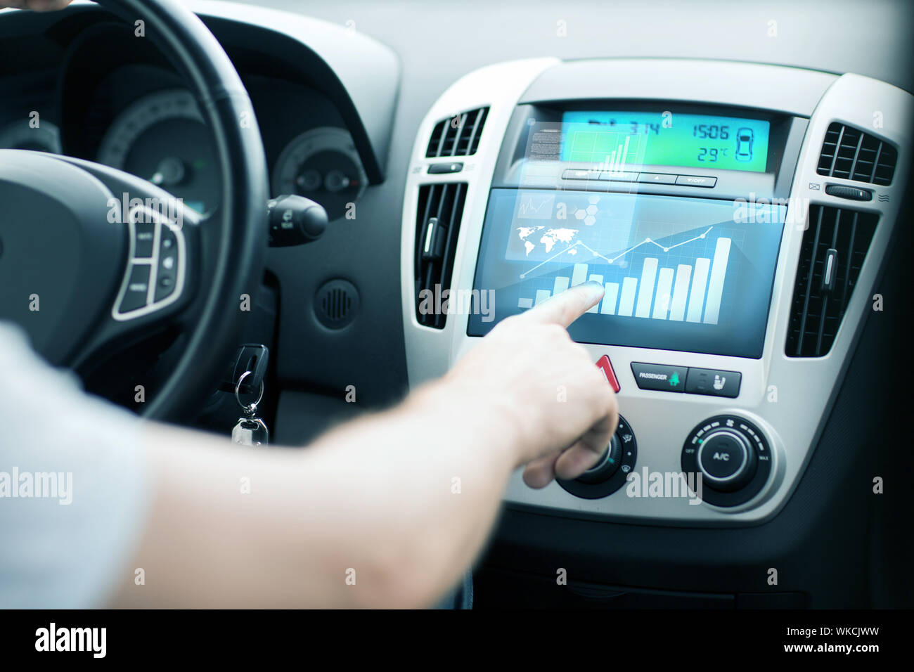 transportation and vehicle concept - man using car control panel Stock ...