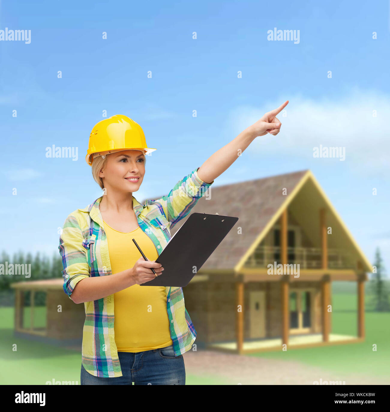repair, construction and maintenance concept - smiling woman in helmet ...