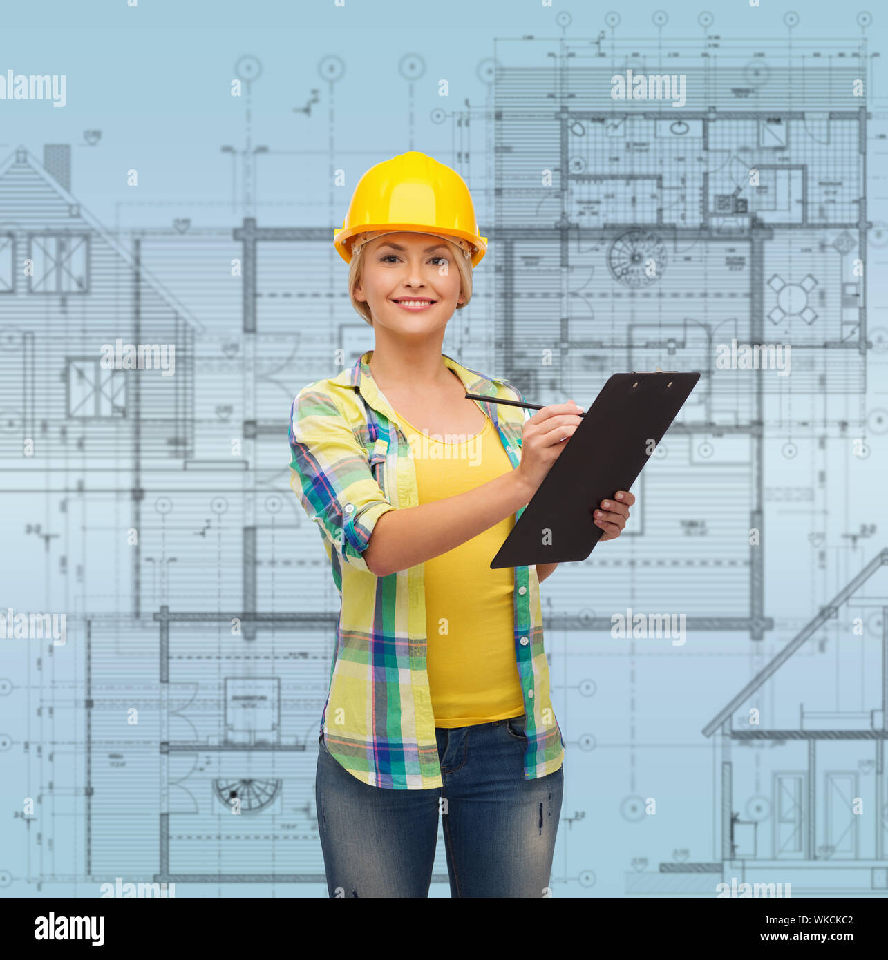 repair, construction and maintenance concept - smiling woman in helmet ...