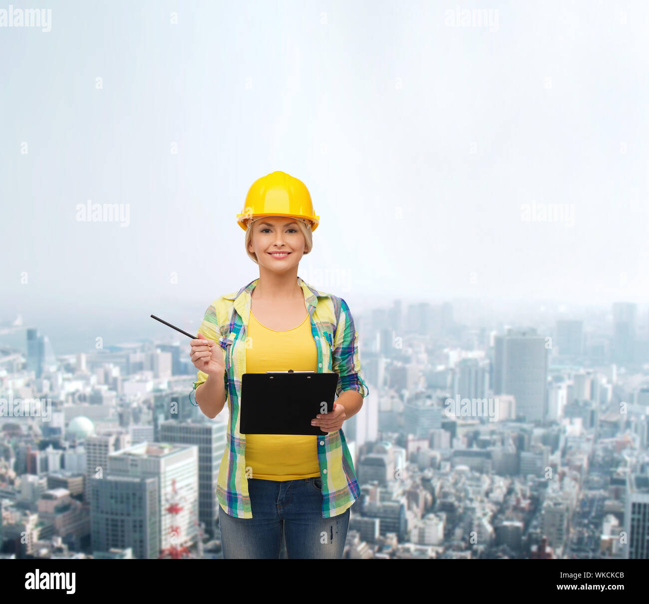 repair, construction and maintenance concept - smiling woman in helmet ...