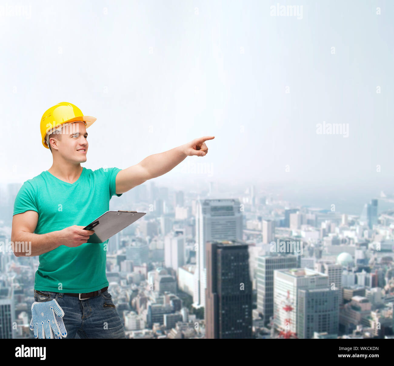 repair, construction and maintenance concept - smiling man in helmet ...