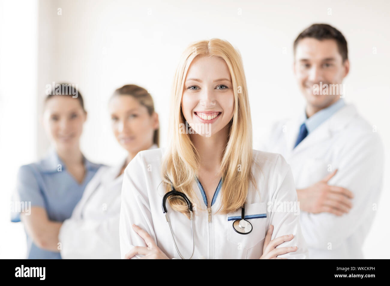healthcare and medicine concept - attractive female doctor in front of ...