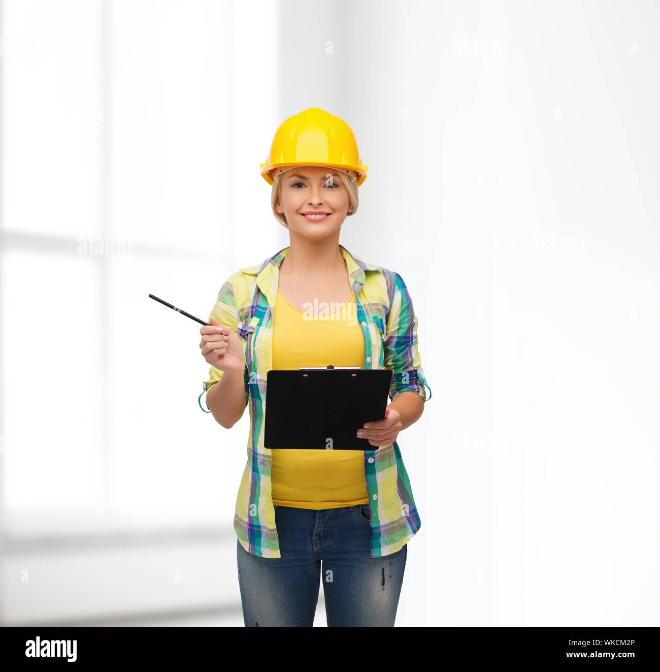 repair, construction and maintenance concept - smiling woman in helmet ...