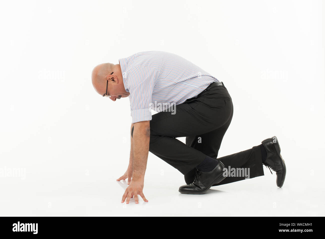 Man at running track in starting position hi-res stock photography and ...