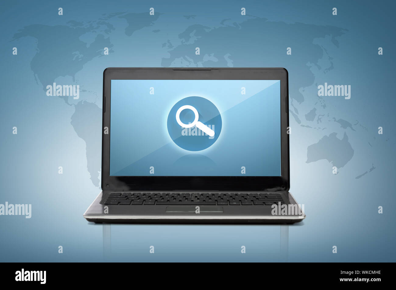 technology and advertisement concept - laptop computer with magnifying ...