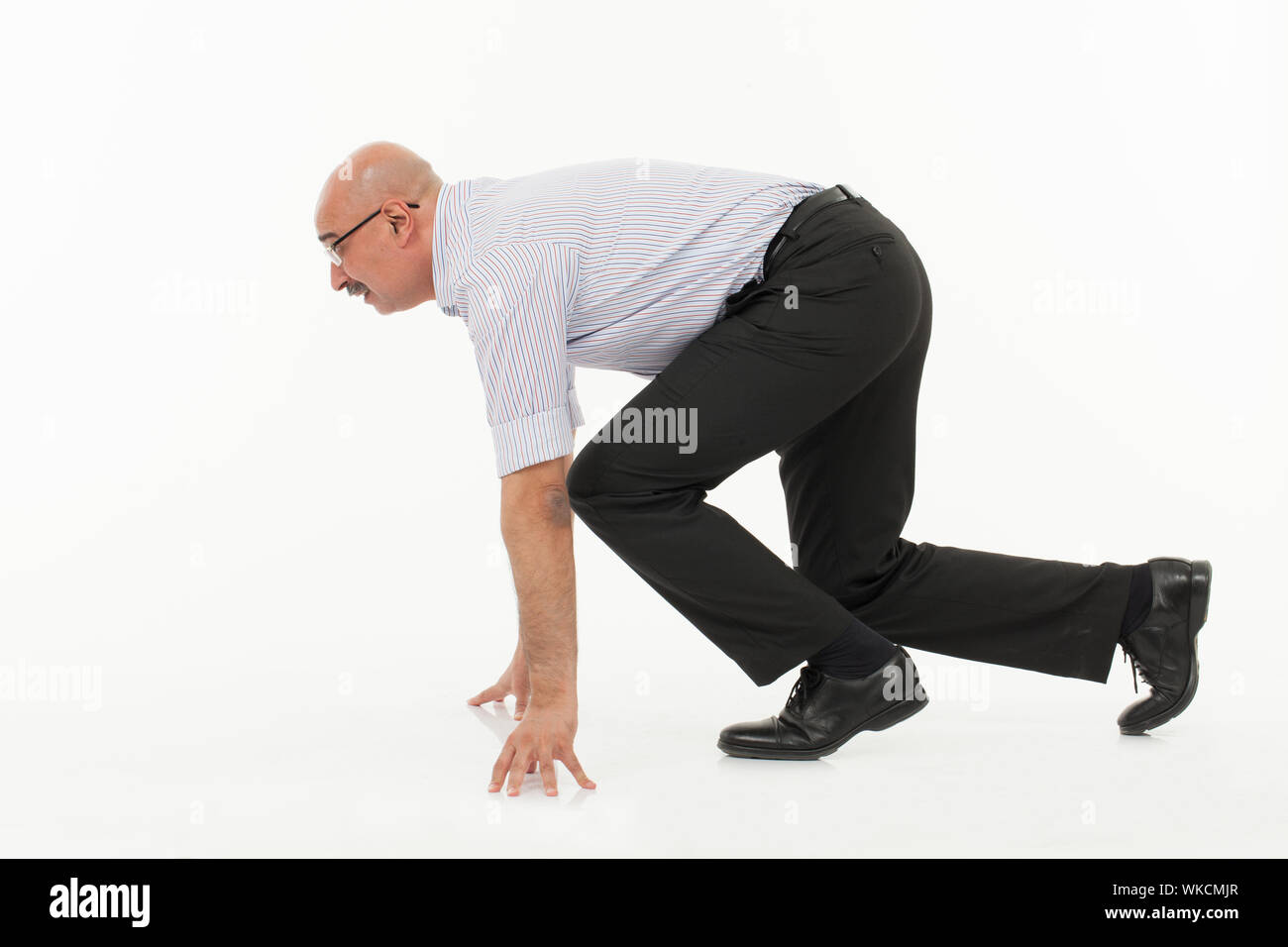 Man at running track in starting position hi-res stock photography and ...