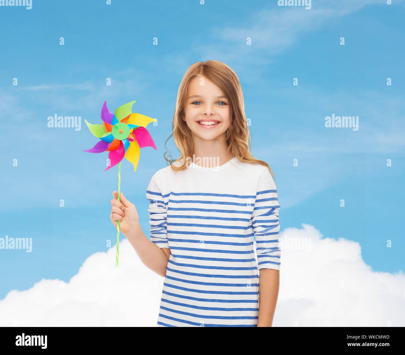 smiling child with colorful windmill toy Stock Photo - Alamy