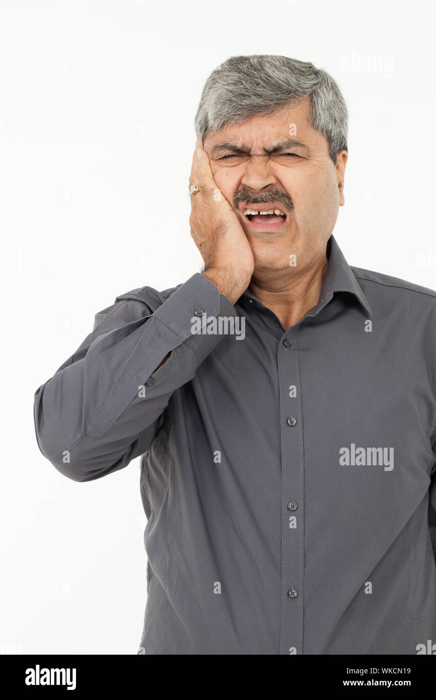 Businessman suffering from toothache Stock Photo - Alamy