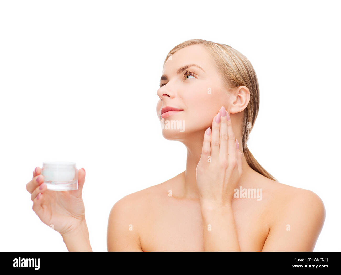 woman applying cream on her skin Stock Photo - Alamy